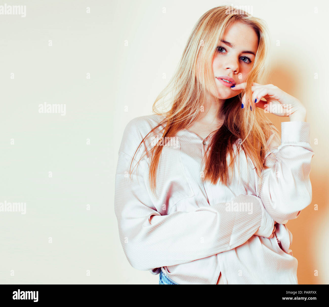 young pretty stylish blond hipster girl posing emotional isolated on ...