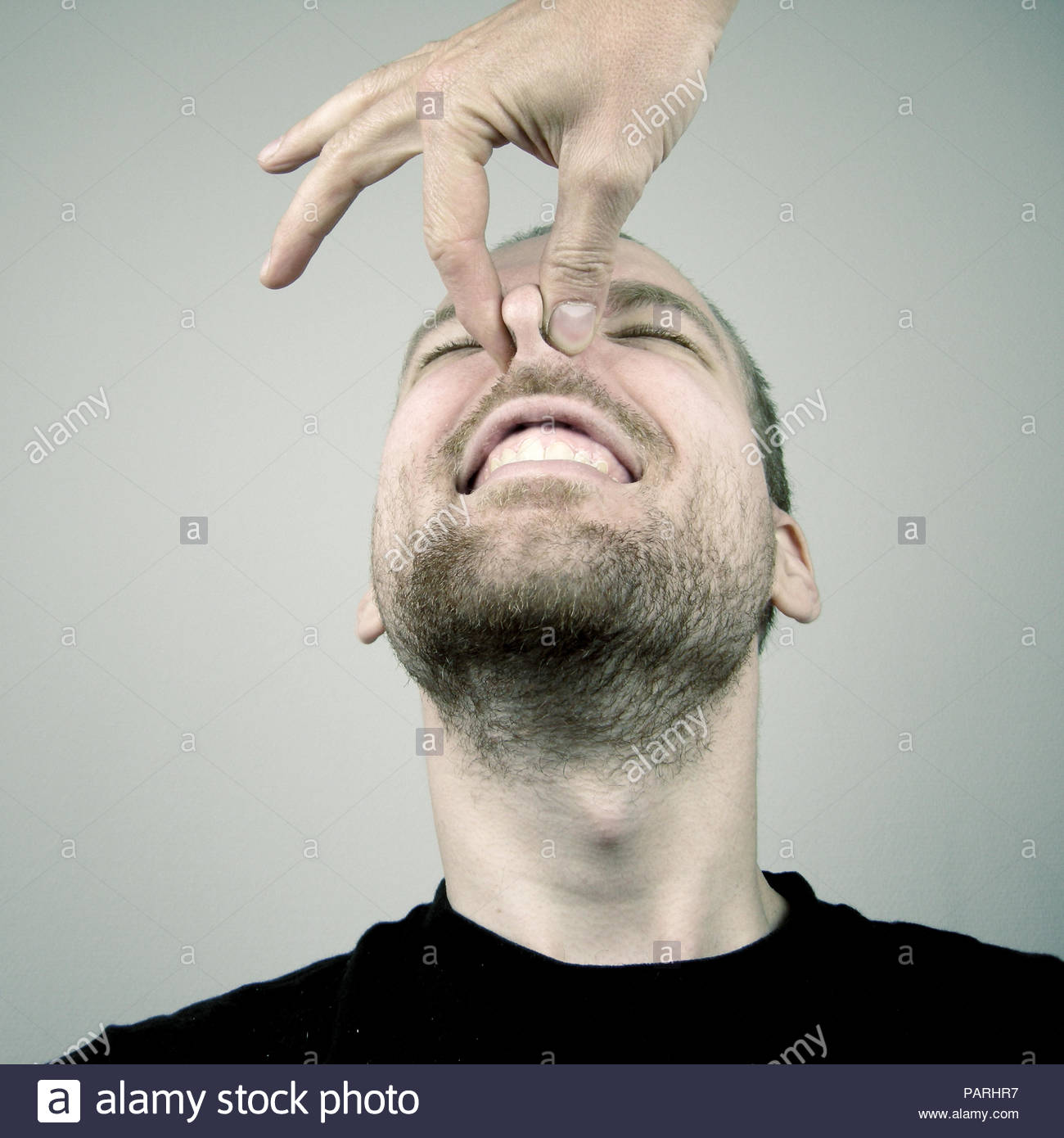 Hand Pinching Nose Stock Photos & Hand Pinching Nose Stock Images - Alamy