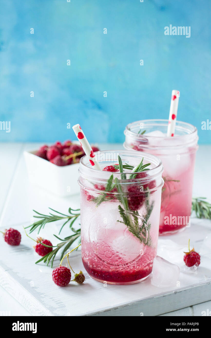SOFT DRINKS. Refreshing summer drink raspberry with rosemary and ice ...