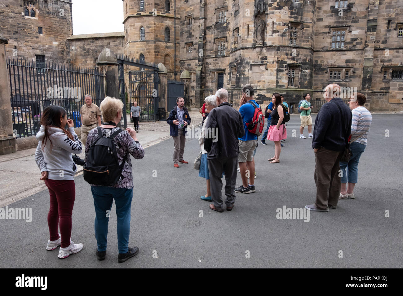 A group of visitors join the guided tour of the historic building of ...