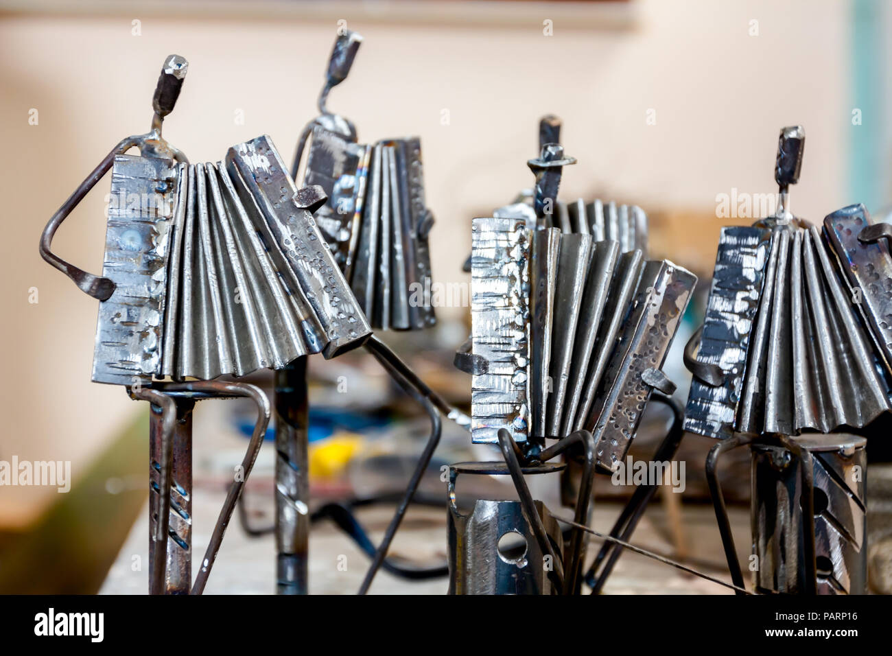 Figures of music performers made with welded metal wire, accordionists ...