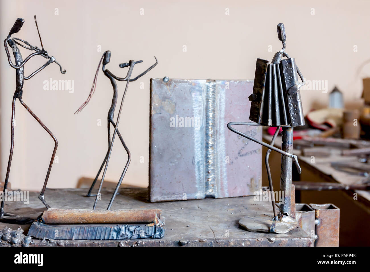 Figures of music performers are made with welded metal wire. Accordion ...