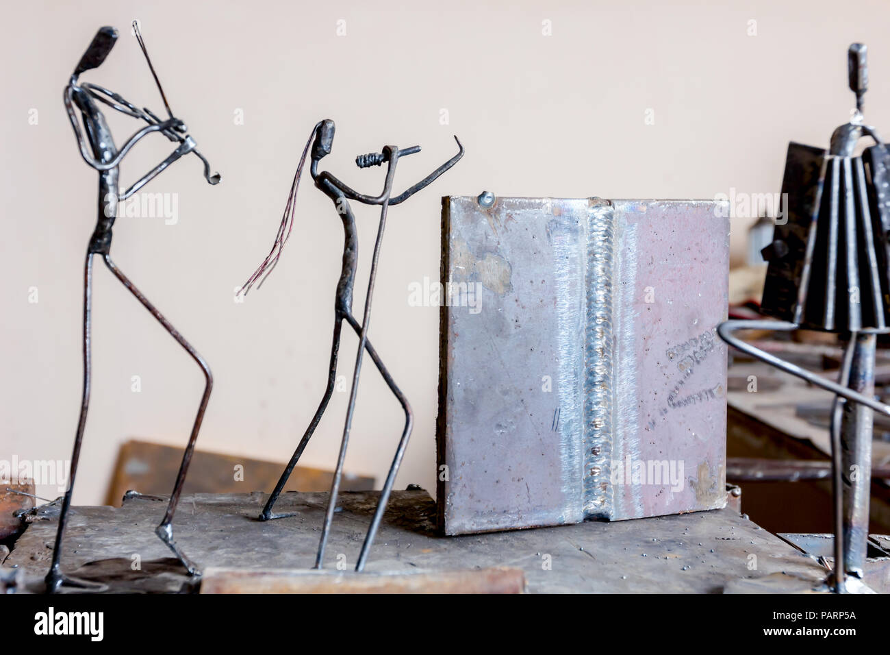Figures of music performers are made with welded metal wire. Accordion ...