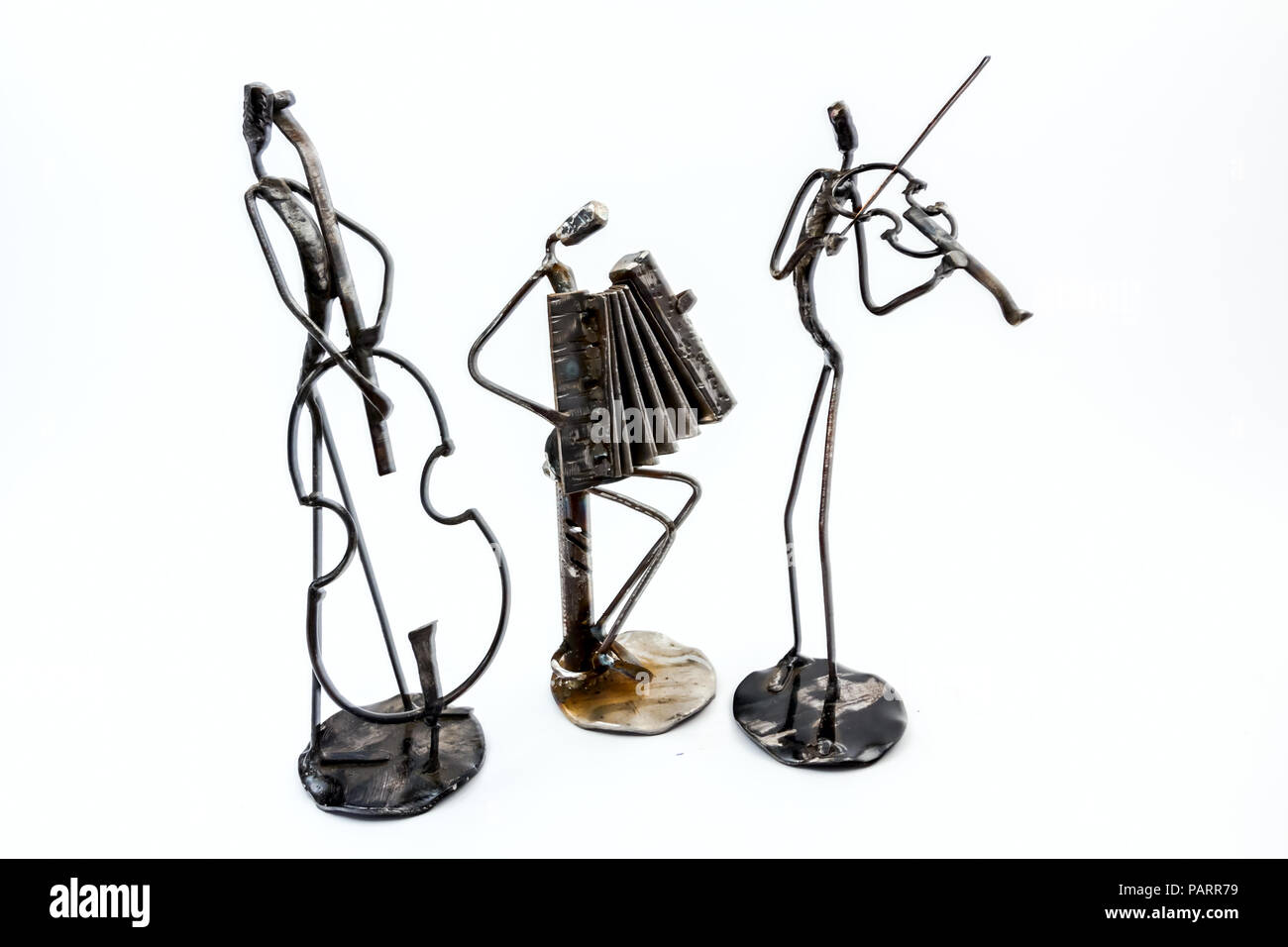 Figures of music performers are playing together, contrabass, accordion ...