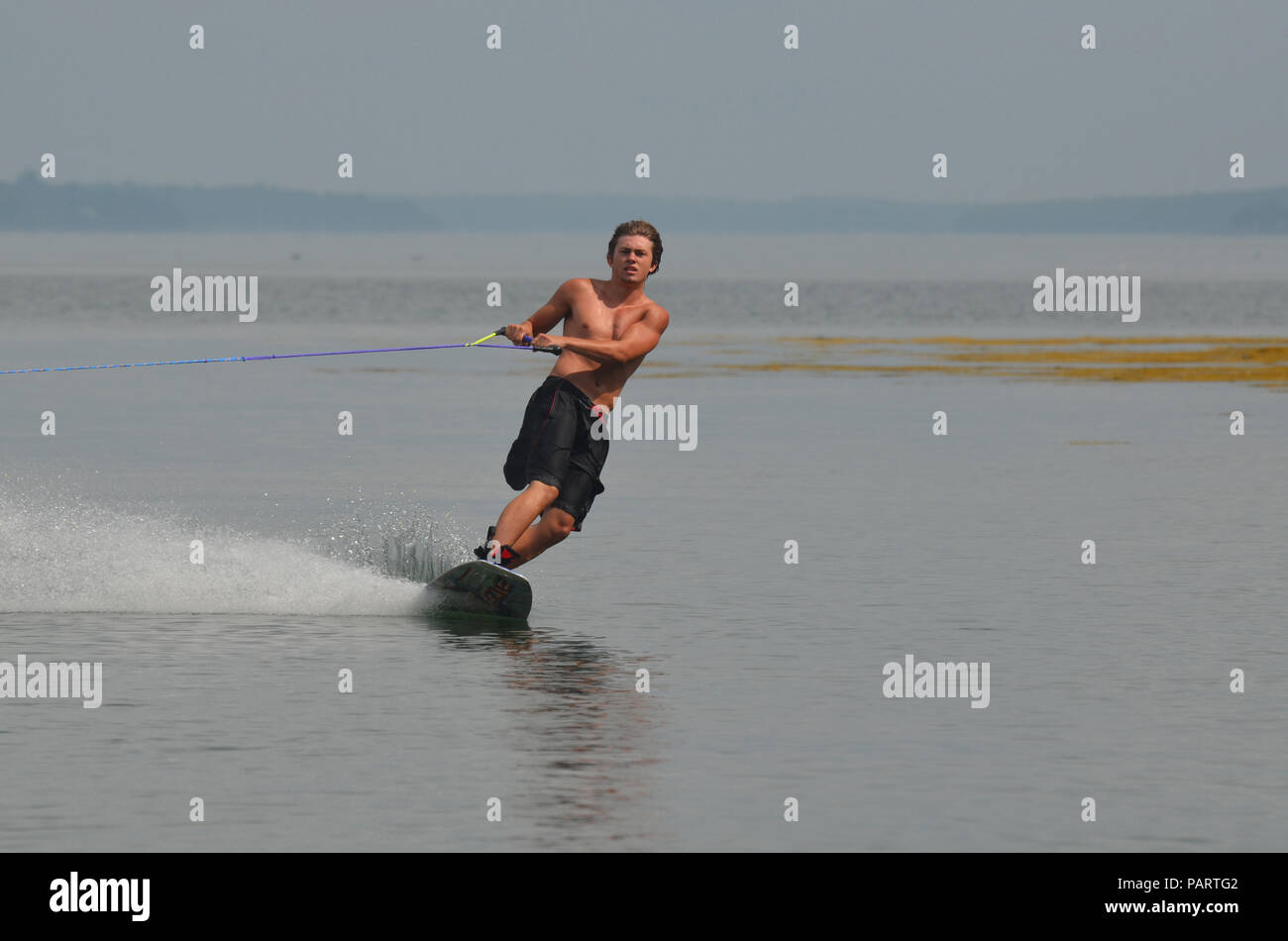 Perfect summer day riding a wakeboard on the ocean in Maine Stock Photo ...
