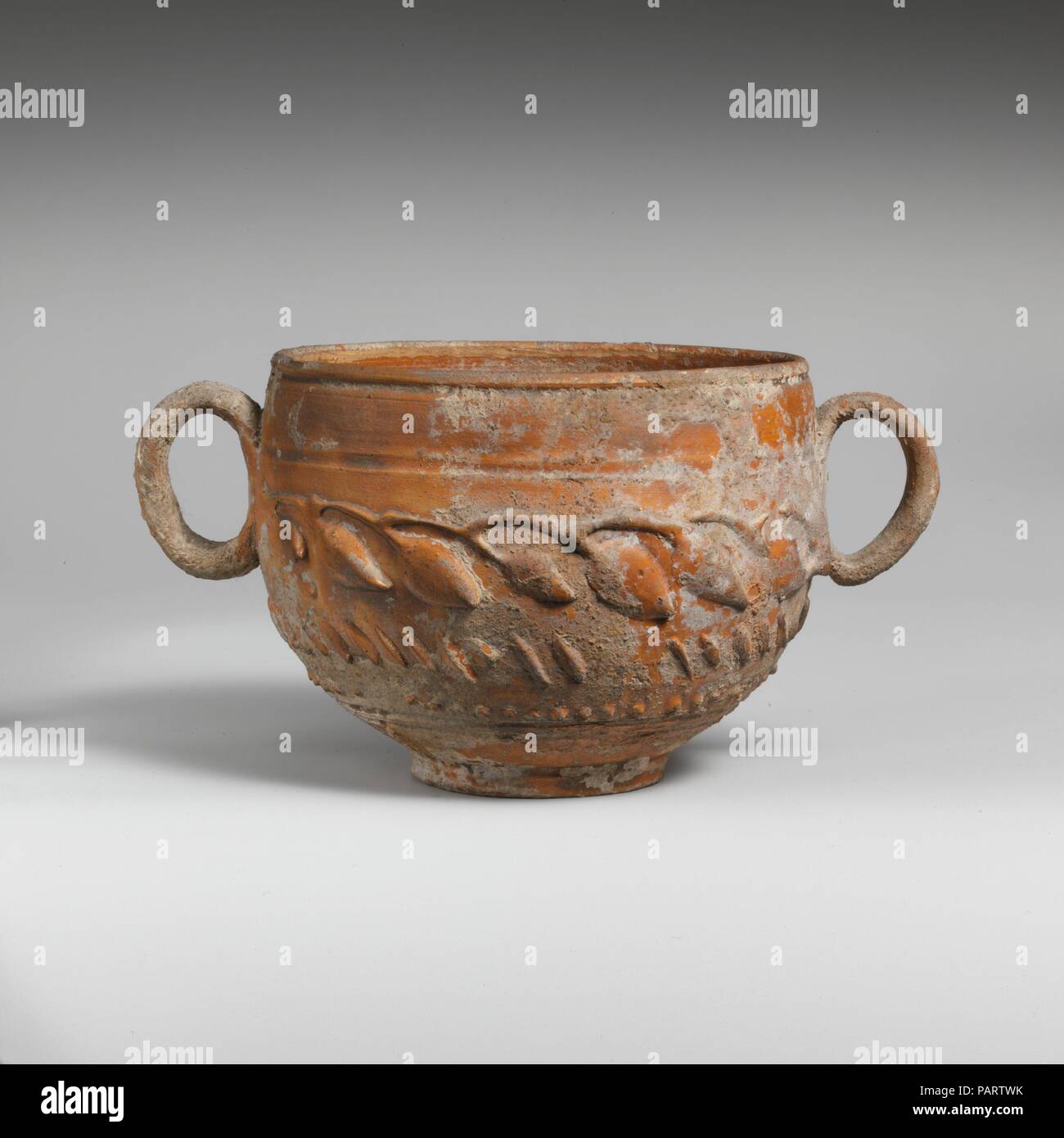 Terracotta scyphus (drinking cup) with barbotine decoration. Culture ...