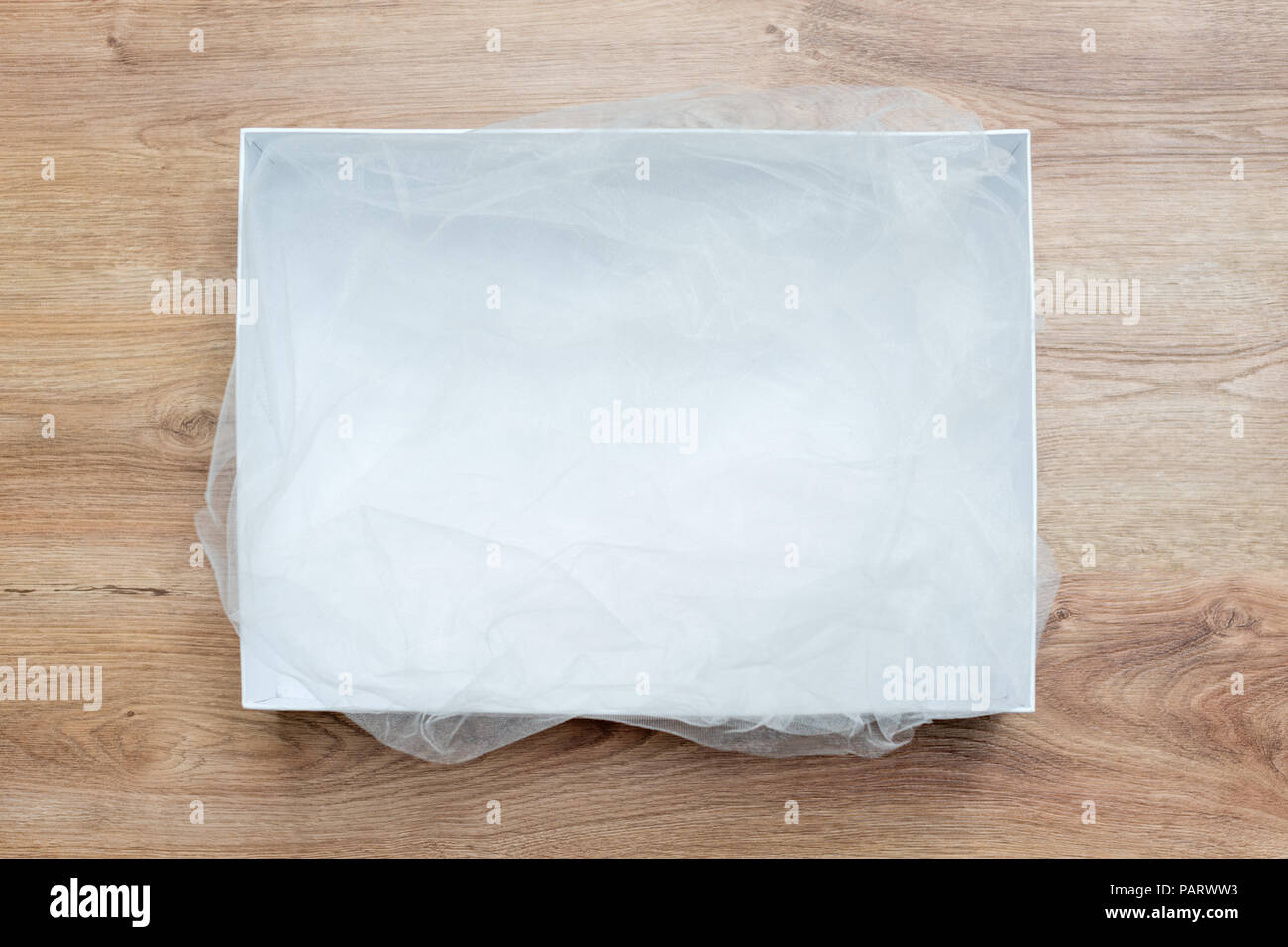 Top view of open empty gift box on wooden table. White giftbox. Present ...