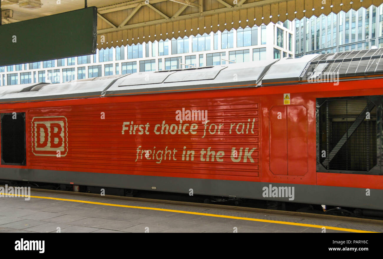 Marketing slogan on the side of a heavy freight locomotive passing ...