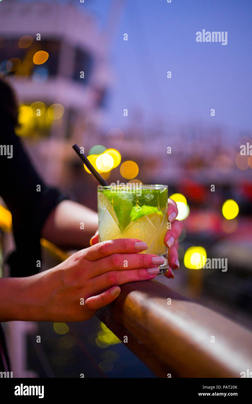 Female holding cocktail hi-res stock photography and images - Alamy