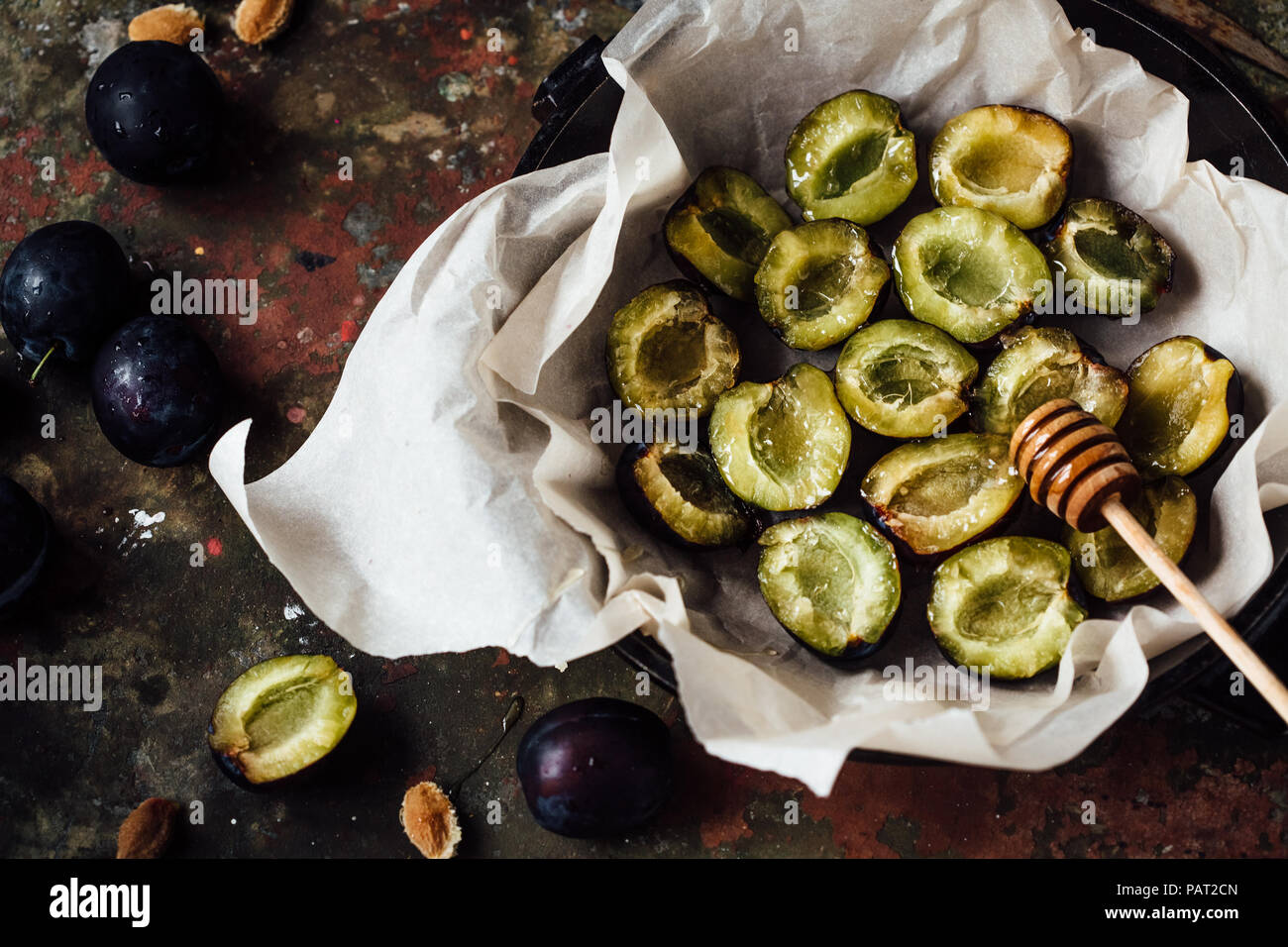 Fresh and ripe sliced plums. Metal background Stock Photo - Alamy