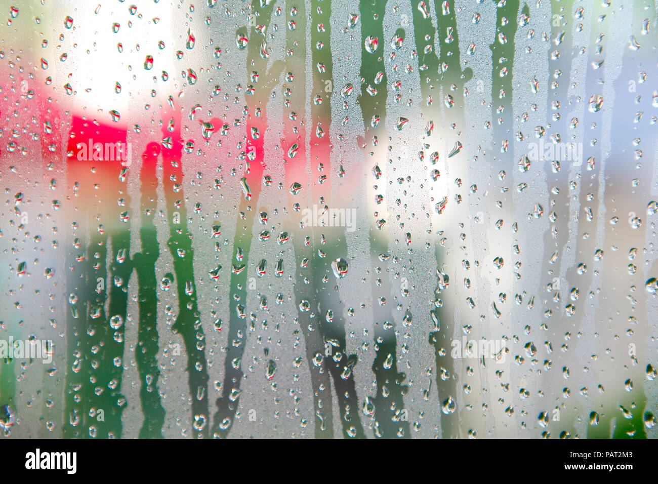 Water running down glass pane hi-res stock photography and images - Alamy