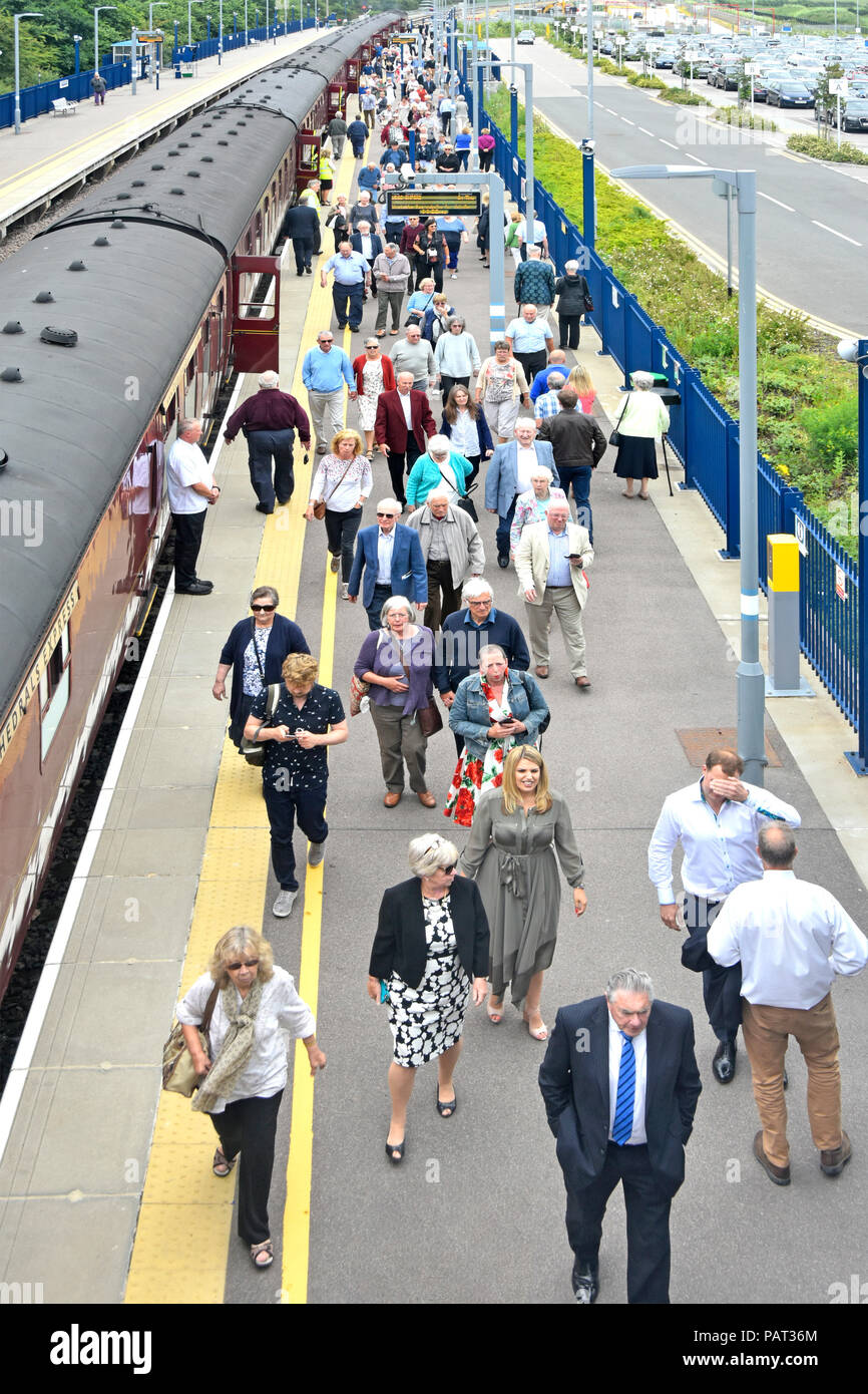 View from above looking down on steam train carriages crowd of people ...