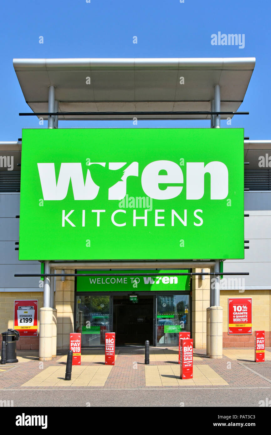 Close up large green store sign for Wren Kitchens retail manufacturing ...