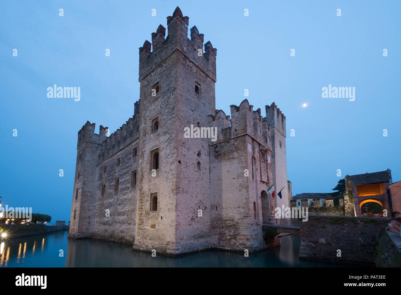 Italy, Lombardy, Lake Garda, Sirmione, Sirmione Castle at dusk, piazza ...