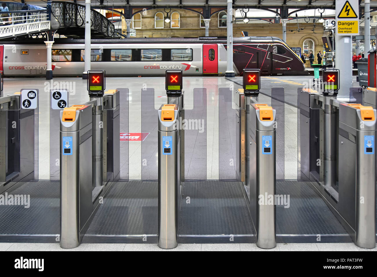 Rail ticket barrier no entry sign with Arriva Cross Country train at ...