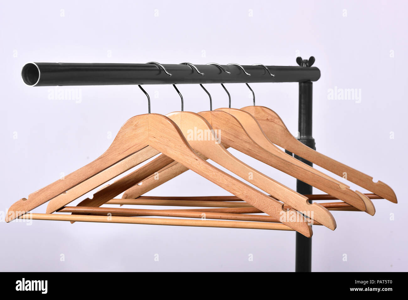 Clothes hanger isolated over white background Stock Photo - Alamy