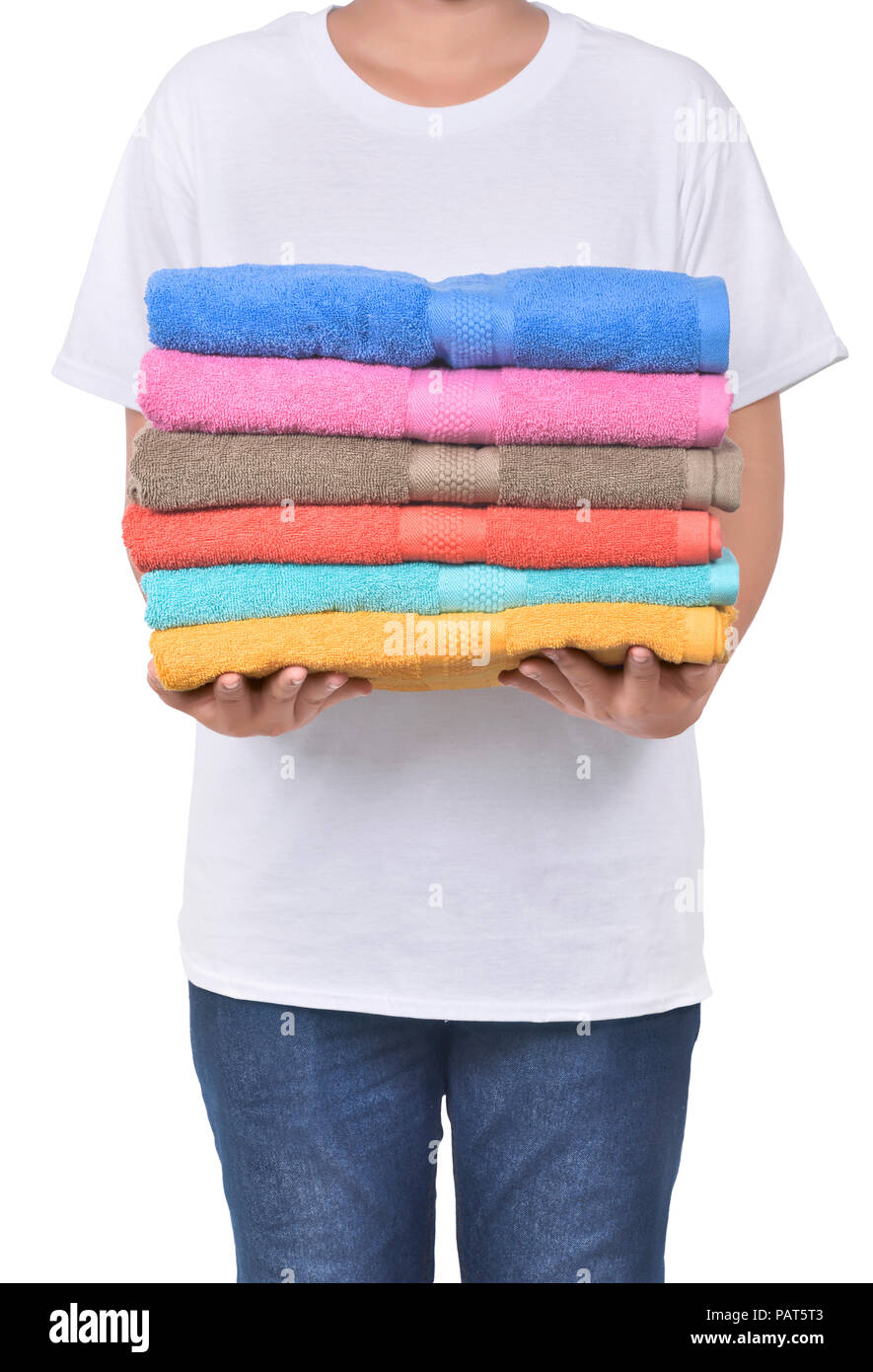 Male hand holding colorful towels pile isolated over white background ...