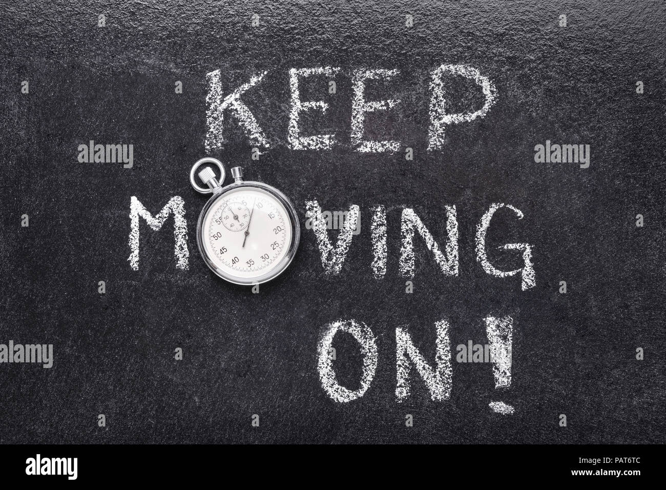 keep moving on exclamation handwritten on blackboard with heart symbol ...
