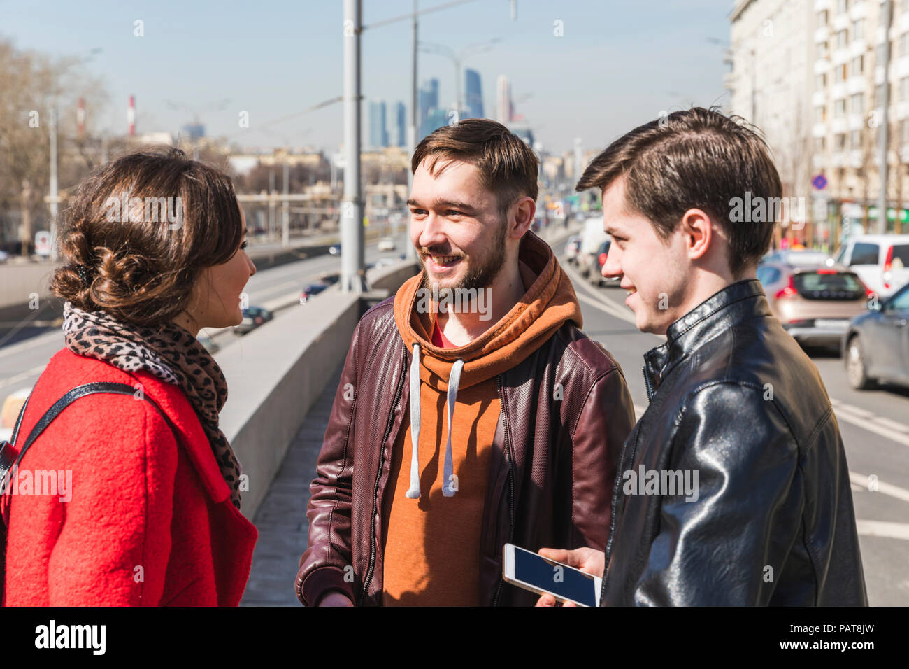 Russia, Moscow, group of friends talking next to a road Stock Photo - Alamy