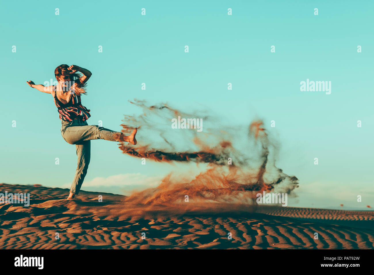 Woman kicking the sand hi-res stock photography and images - Alamy