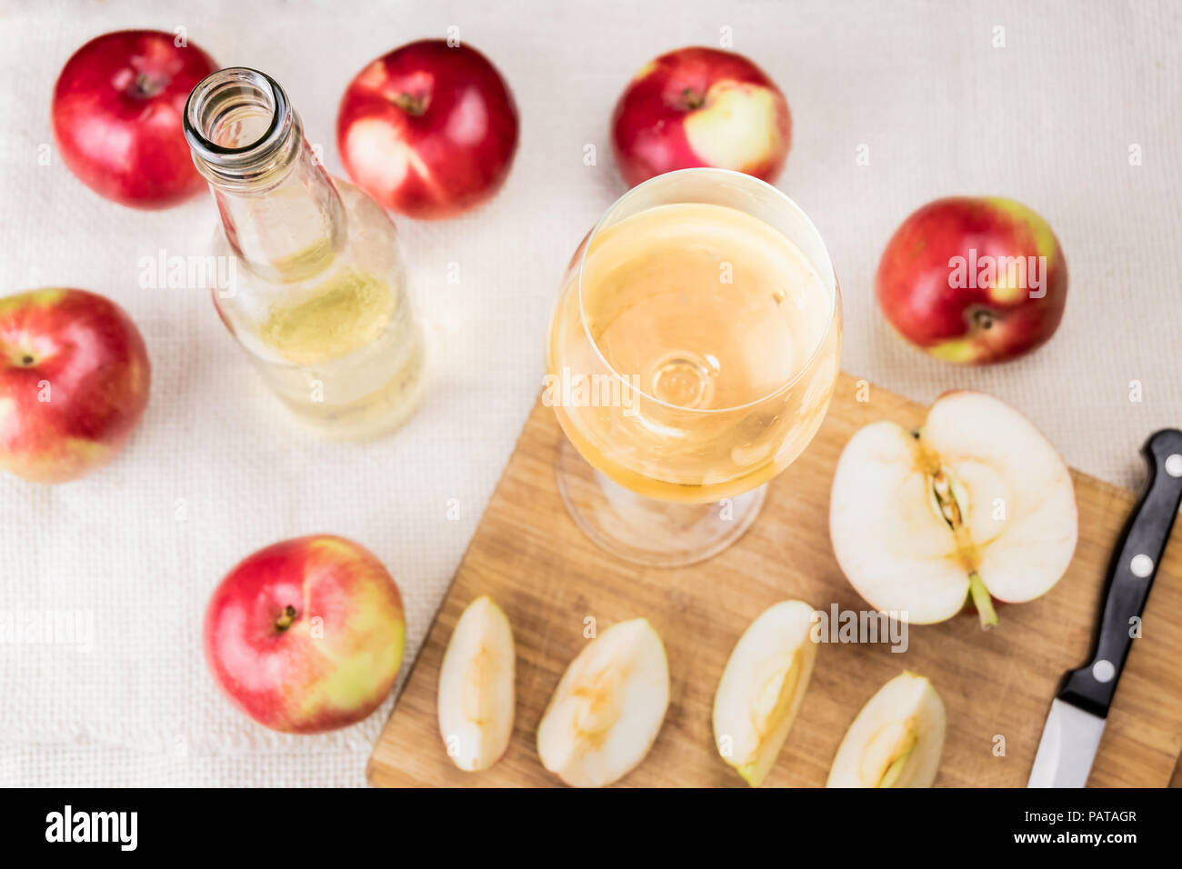 Flat lay with glass of cidre drink on rustic wooden table. Top view of ...