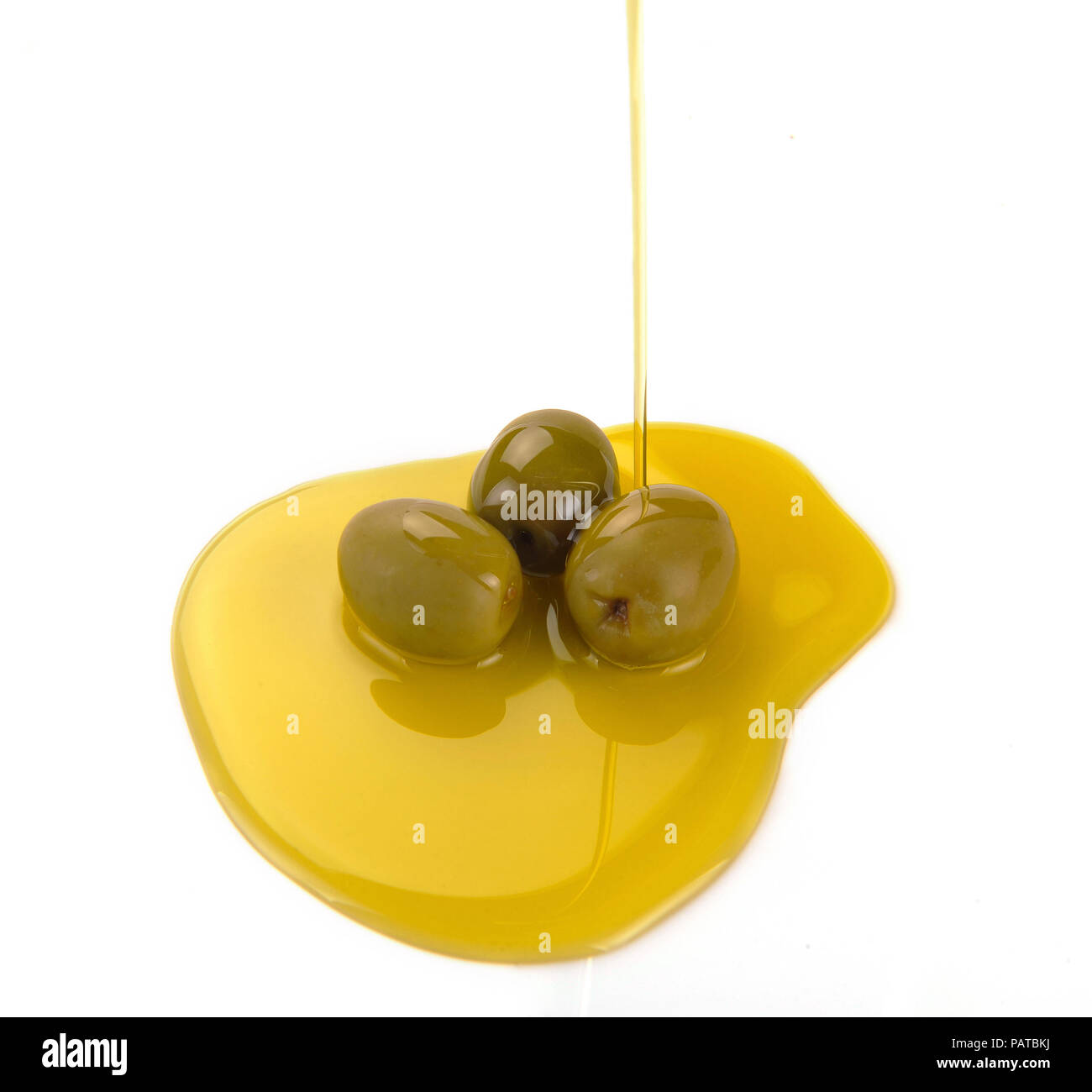Olive oil pouring out. Pouring olive oil Stock Photo - Alamy