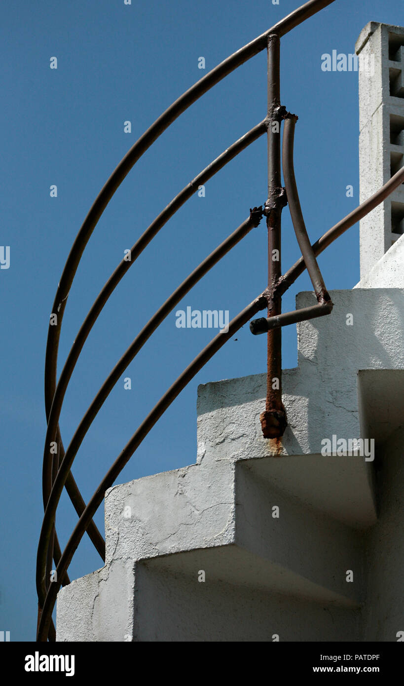 Broken iron handrail on exterior Art Deco staircase Stock Photo - Alamy
