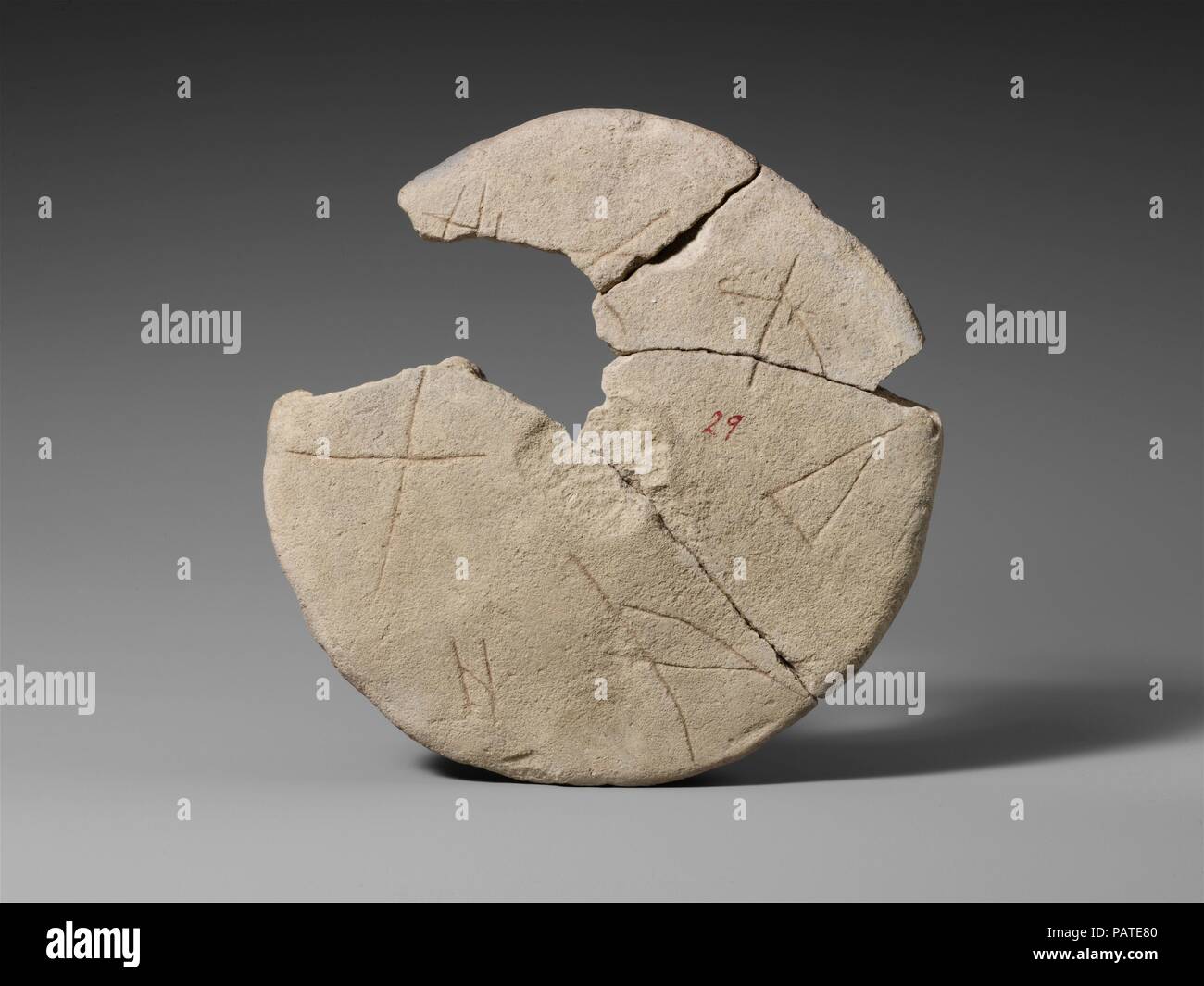 Limestone inscribed disk. Culture: Cypriot. Dimensions: Other: Diameter ...