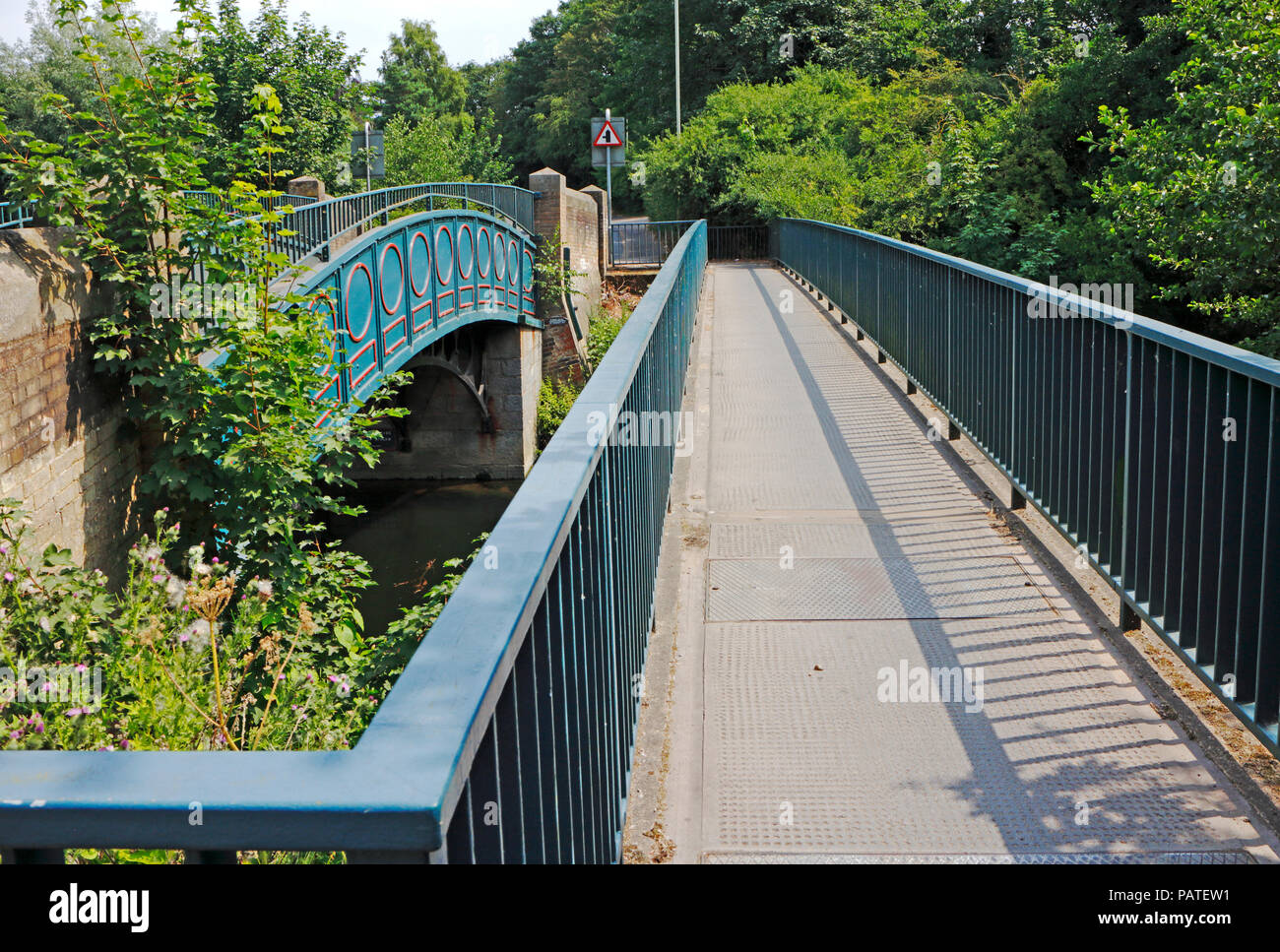 A pedestrian bridge over the River Wensum built next to the 19th ...