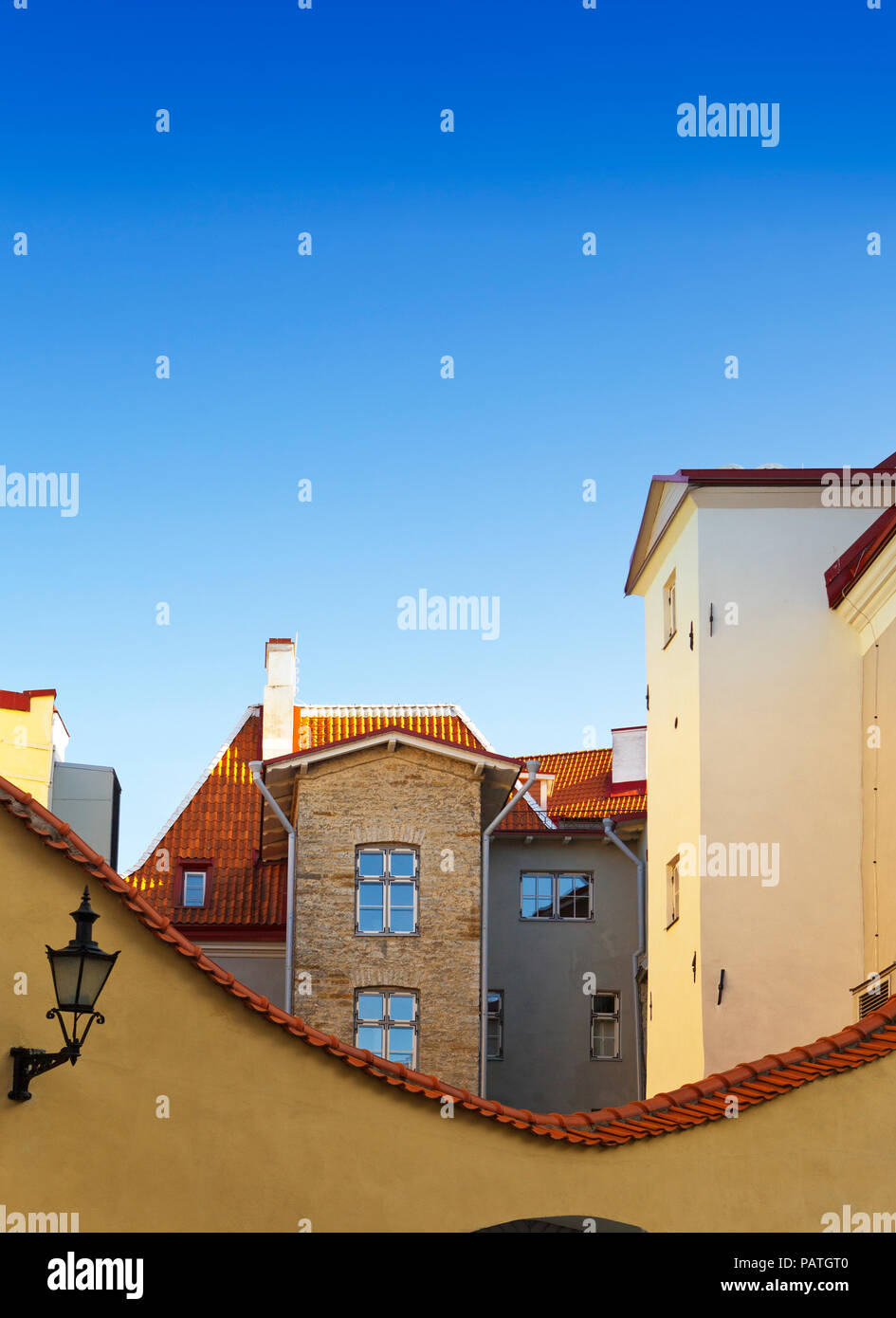 Medieval houses and roofs with a red tile in the old city of Tallinn ...