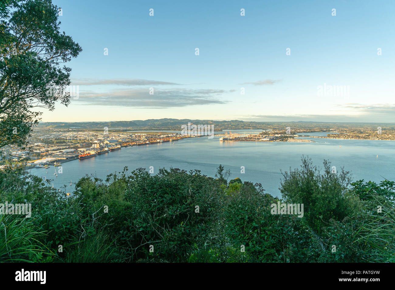Tauranga harbour and the port wharves with distant hills Stock Photo ...