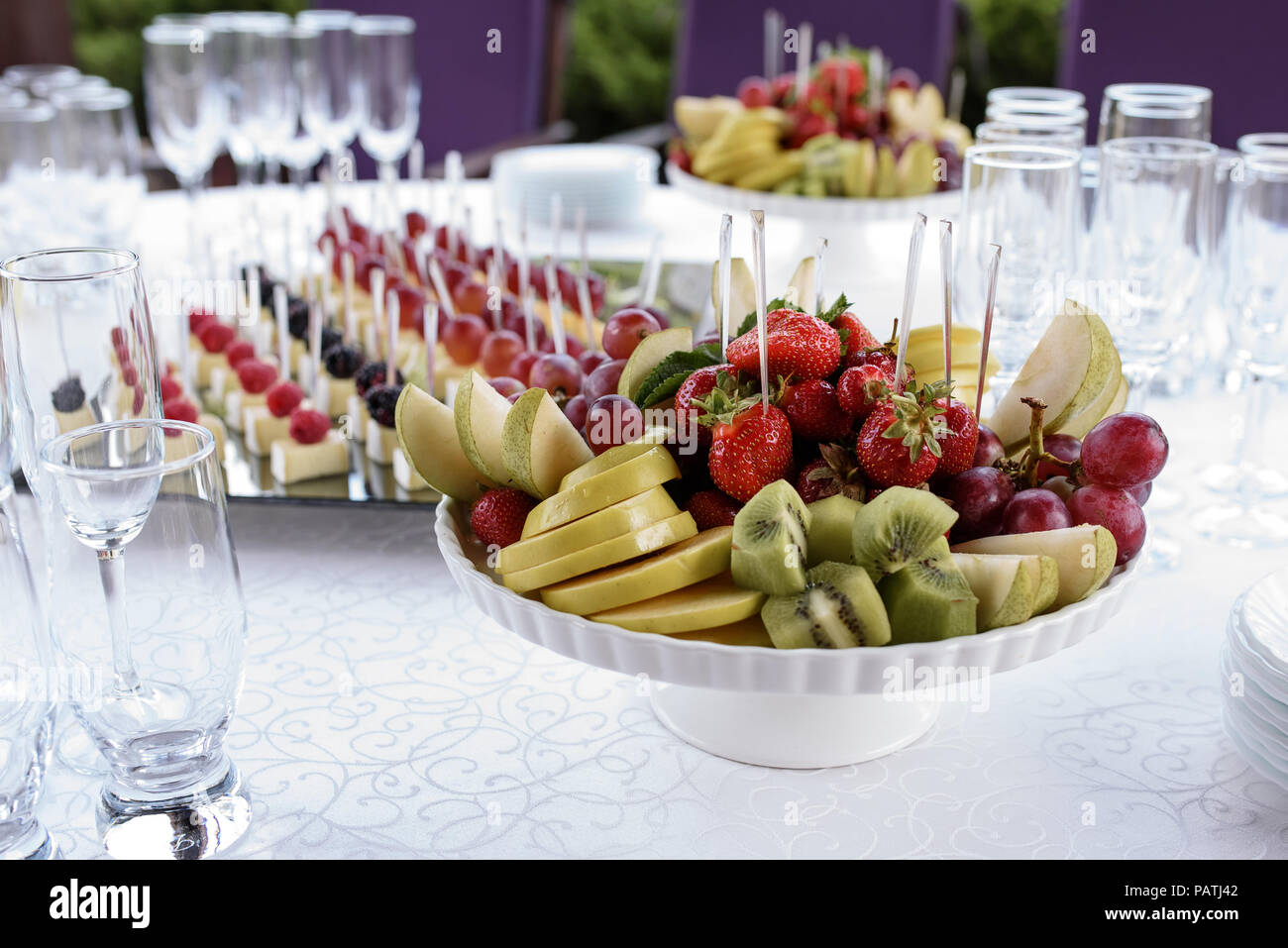 White fruit-pot with the range of bright fruit Stock Photo - Alamy