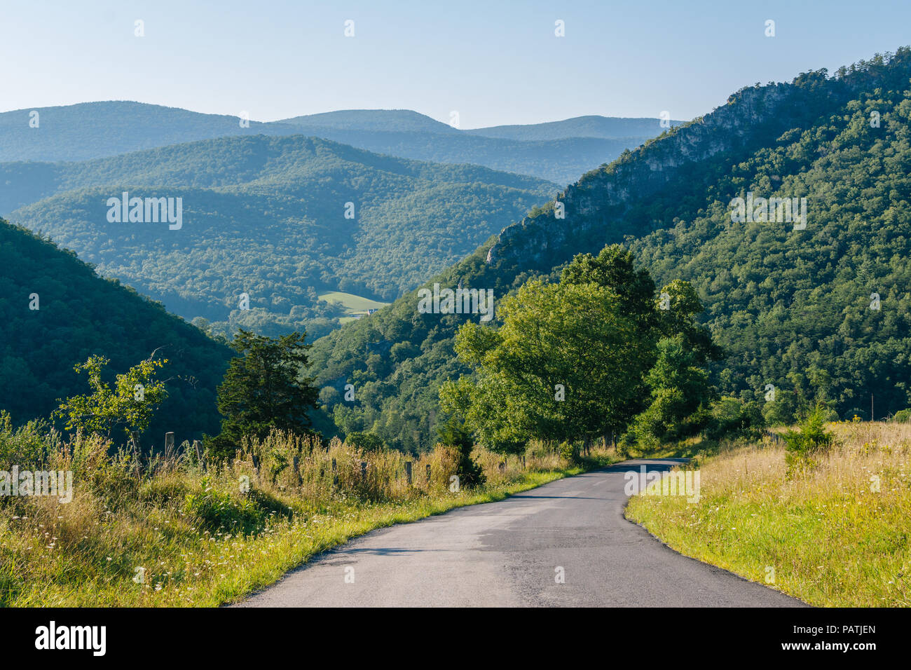 A road and view of mountains in the rural Potomac Highlands of West ...