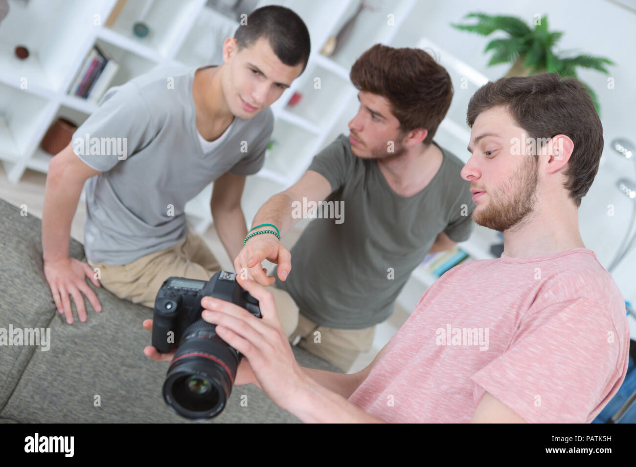 group of friends photographers taking photo together Stock Photo - Alamy