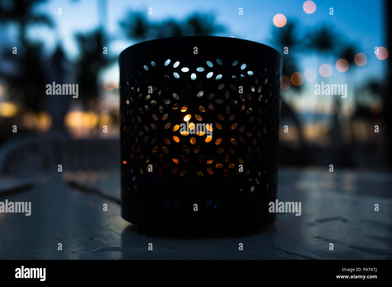 Romantic candlelit table with view of beach sunset and coconut trees at ...