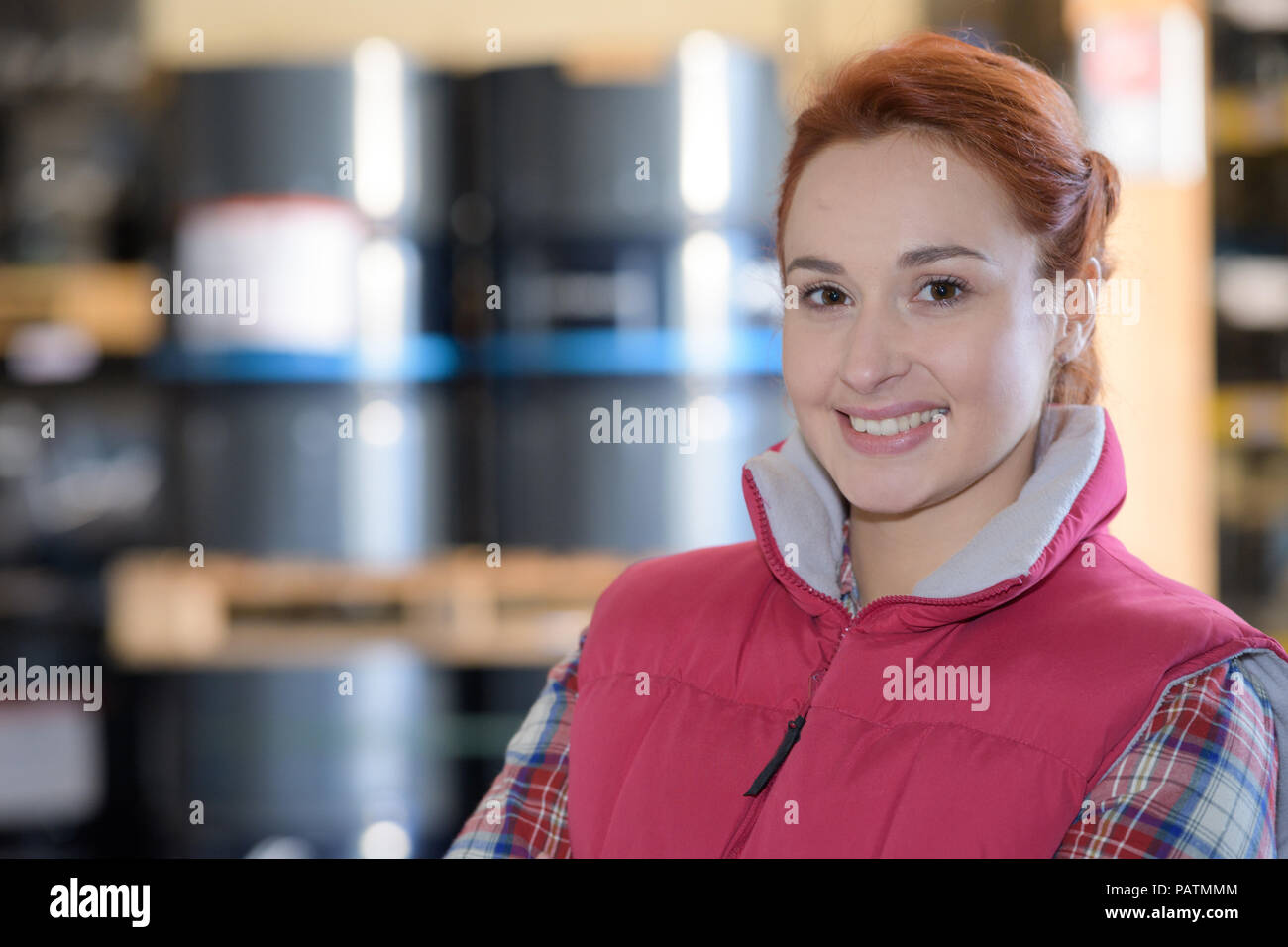 Woman in factory warehouse hi-res stock photography and images - Alamy
