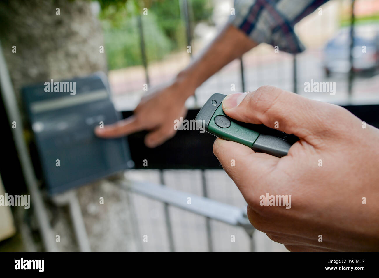 Man setting a remote control Stock Photo - Alamy