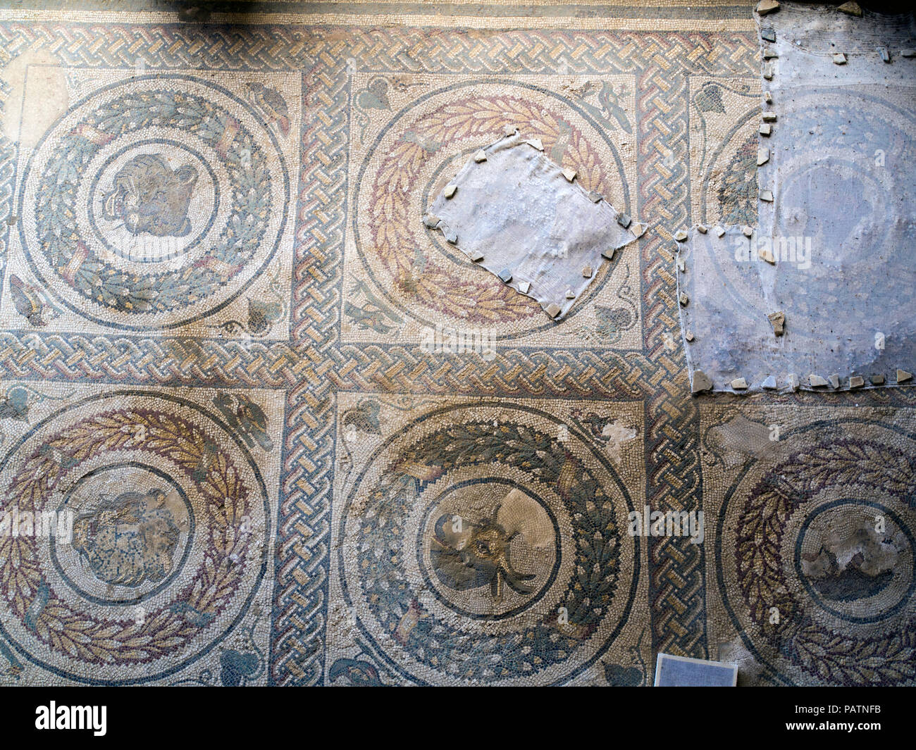 Restoration on the 4th century tile mosaics of Villa Romana del Casale ...