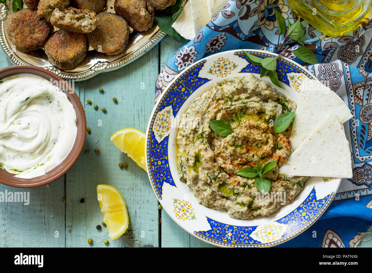 Arabic cuisine. Fresh homemade creamy mung hummus with spicy, falafel ...