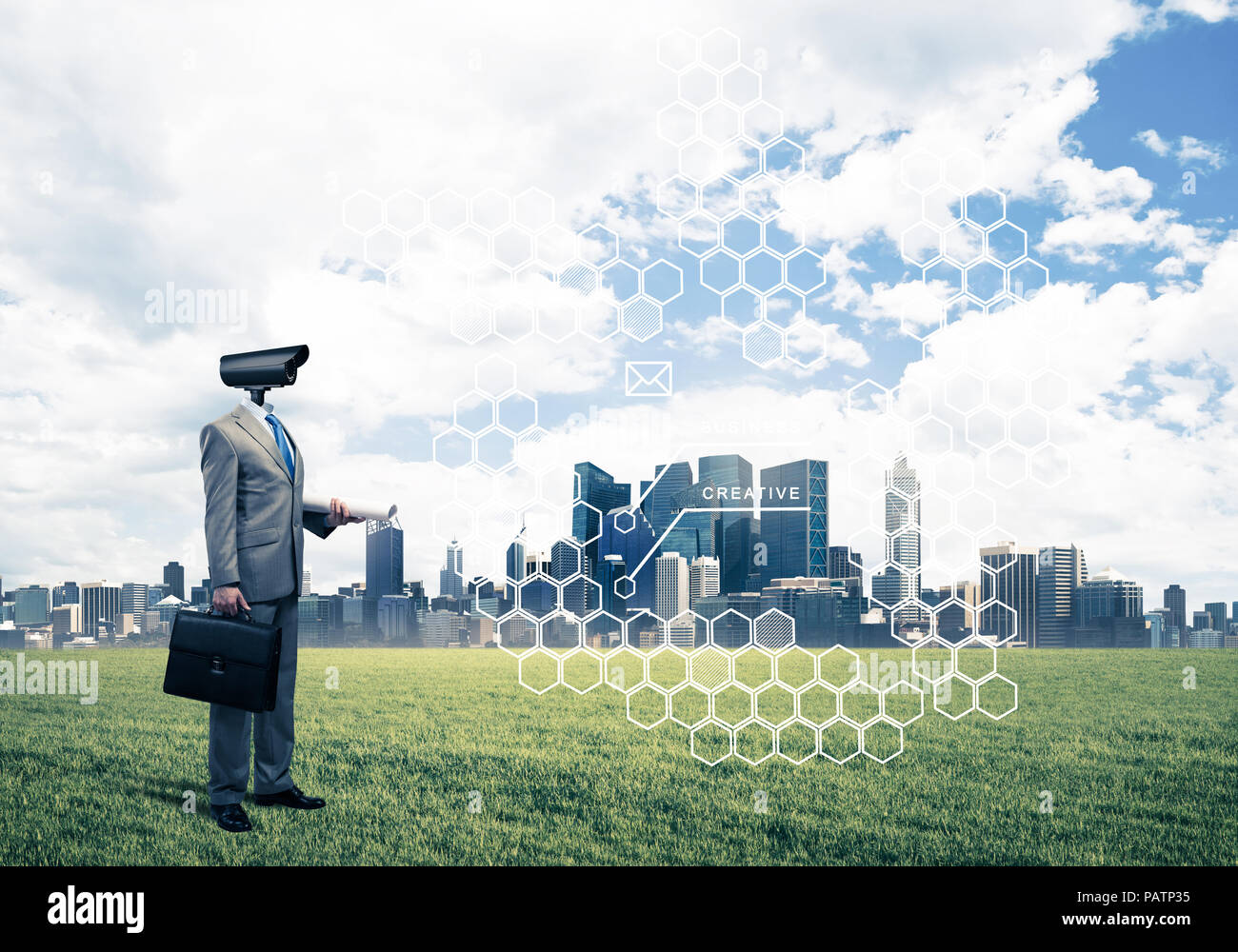 Camera headed man standing on green grass against modern citysca Stock ...