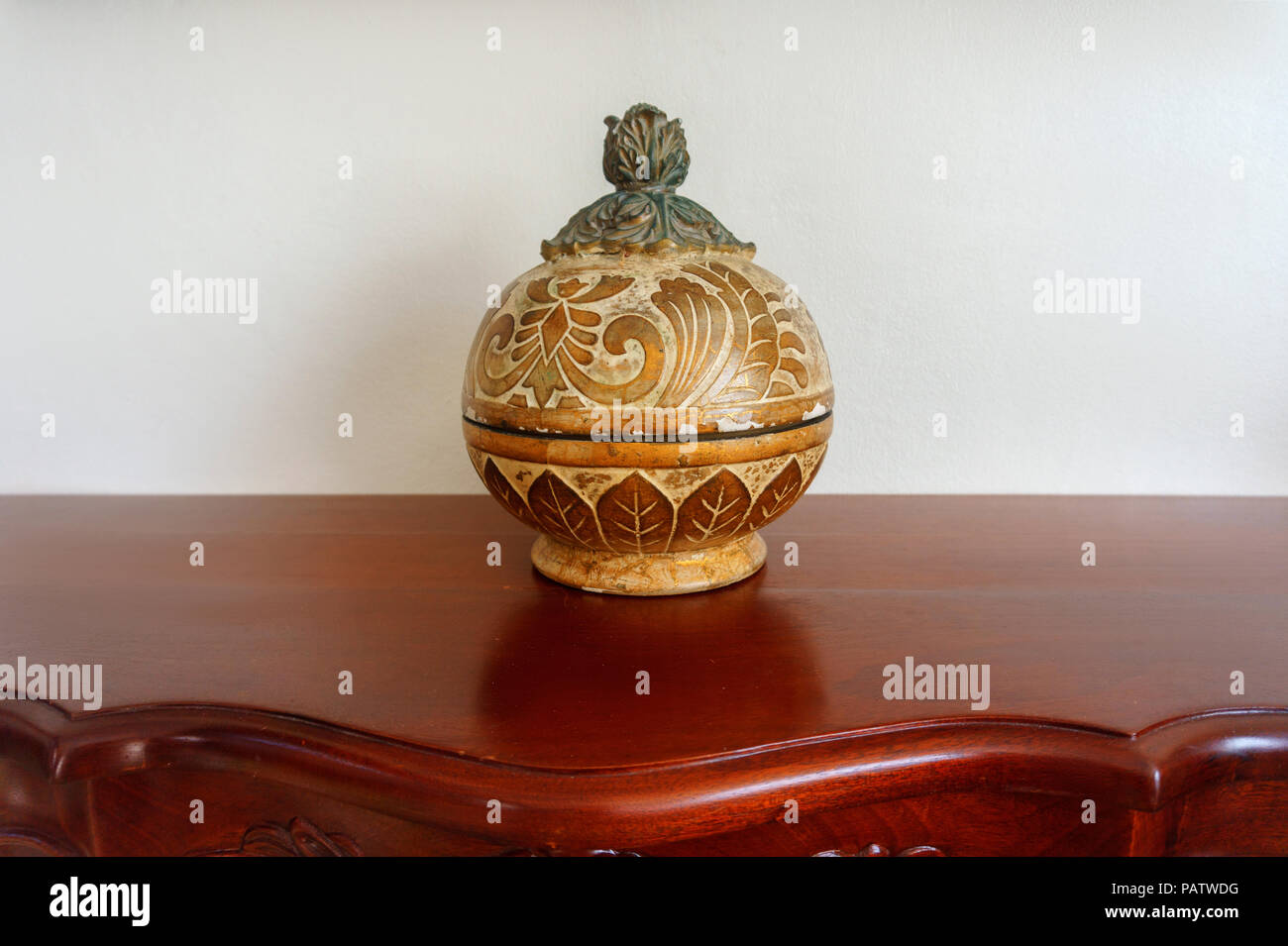 vintage designer creative ball shaped casket on wooden shelf Stock ...