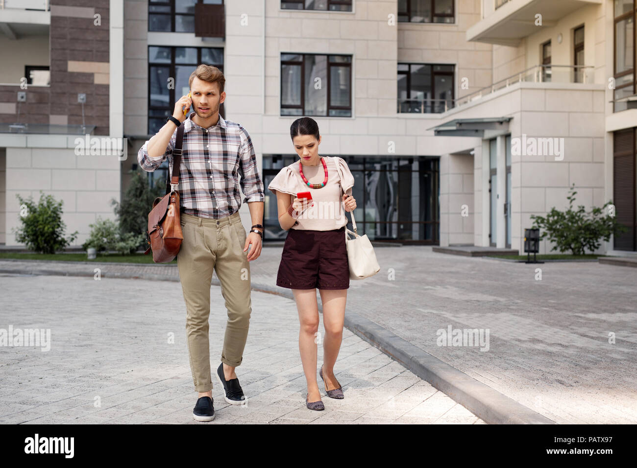 Smart young people going to work Stock Photo - Alamy