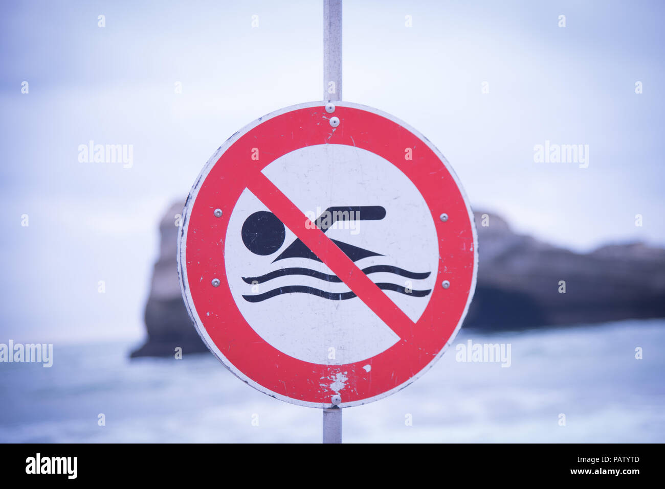 A red and white 'do not swim sign' on the beach in Biarritz,France ...