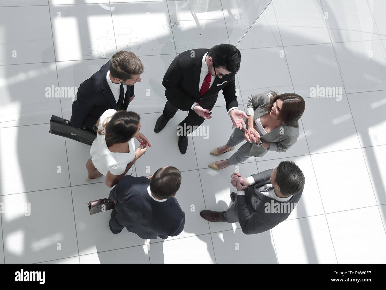 top view. employees discussing current tasks Stock Photo - Alamy