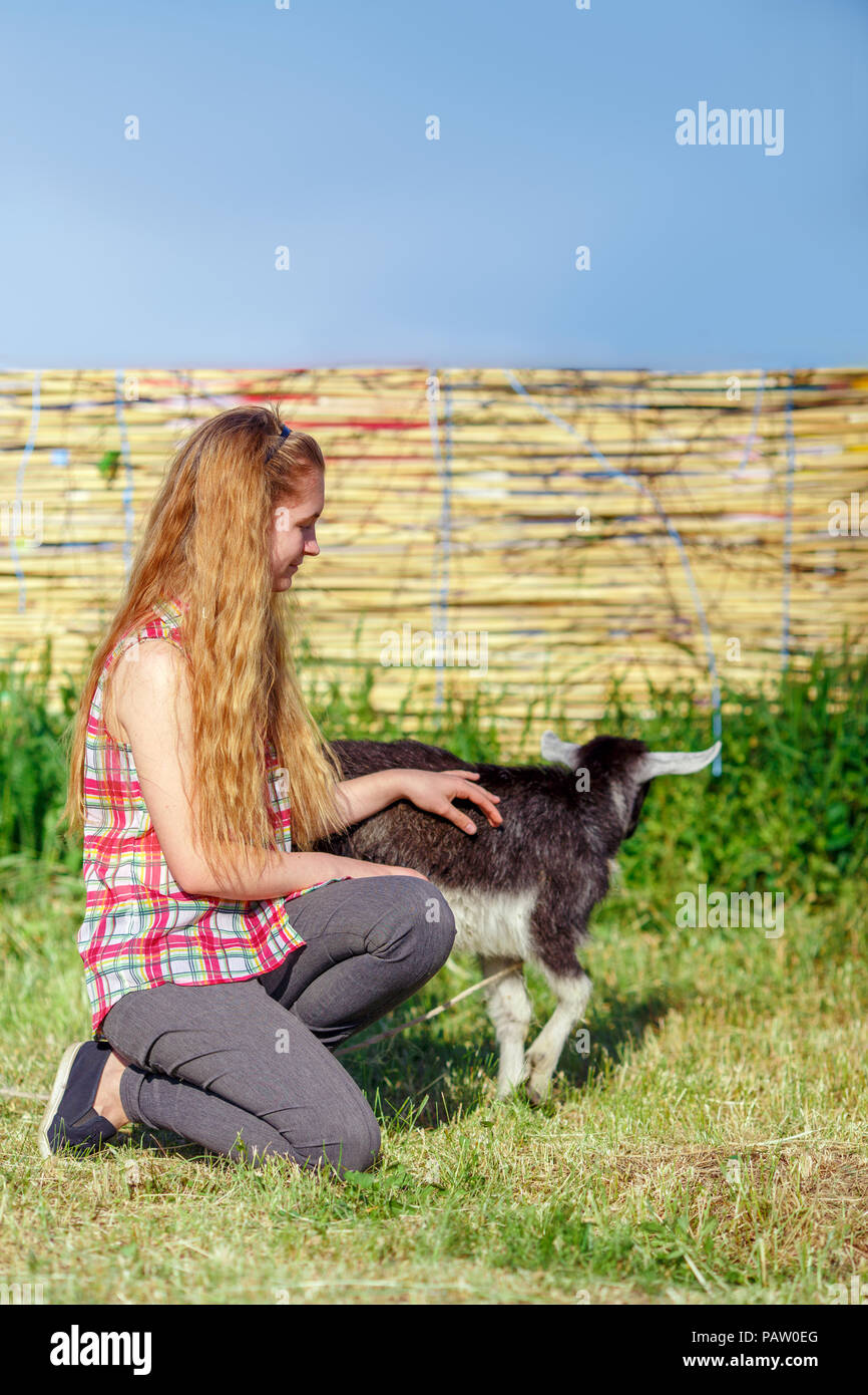 Beautiful girl with goat hi-res stock photography and images - Alamy