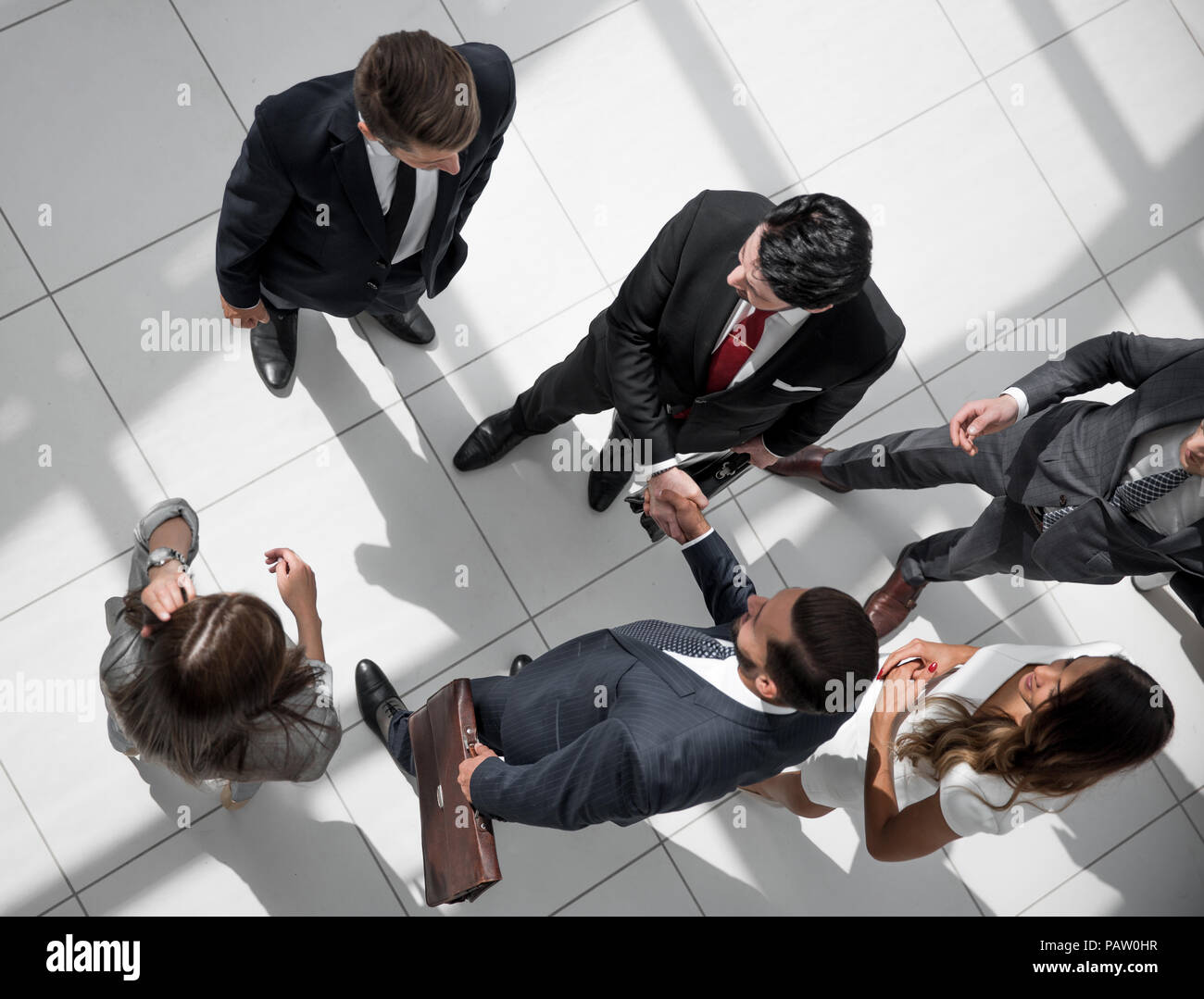 top view. handshake business partners at the meeting Stock Photo - Alamy