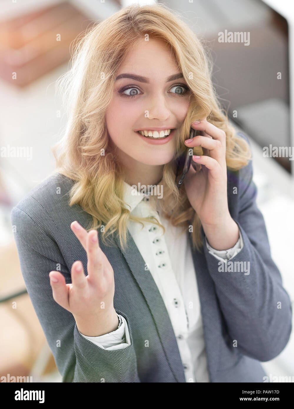 happy employee is talking on the smartphone Stock Photo - Alamy