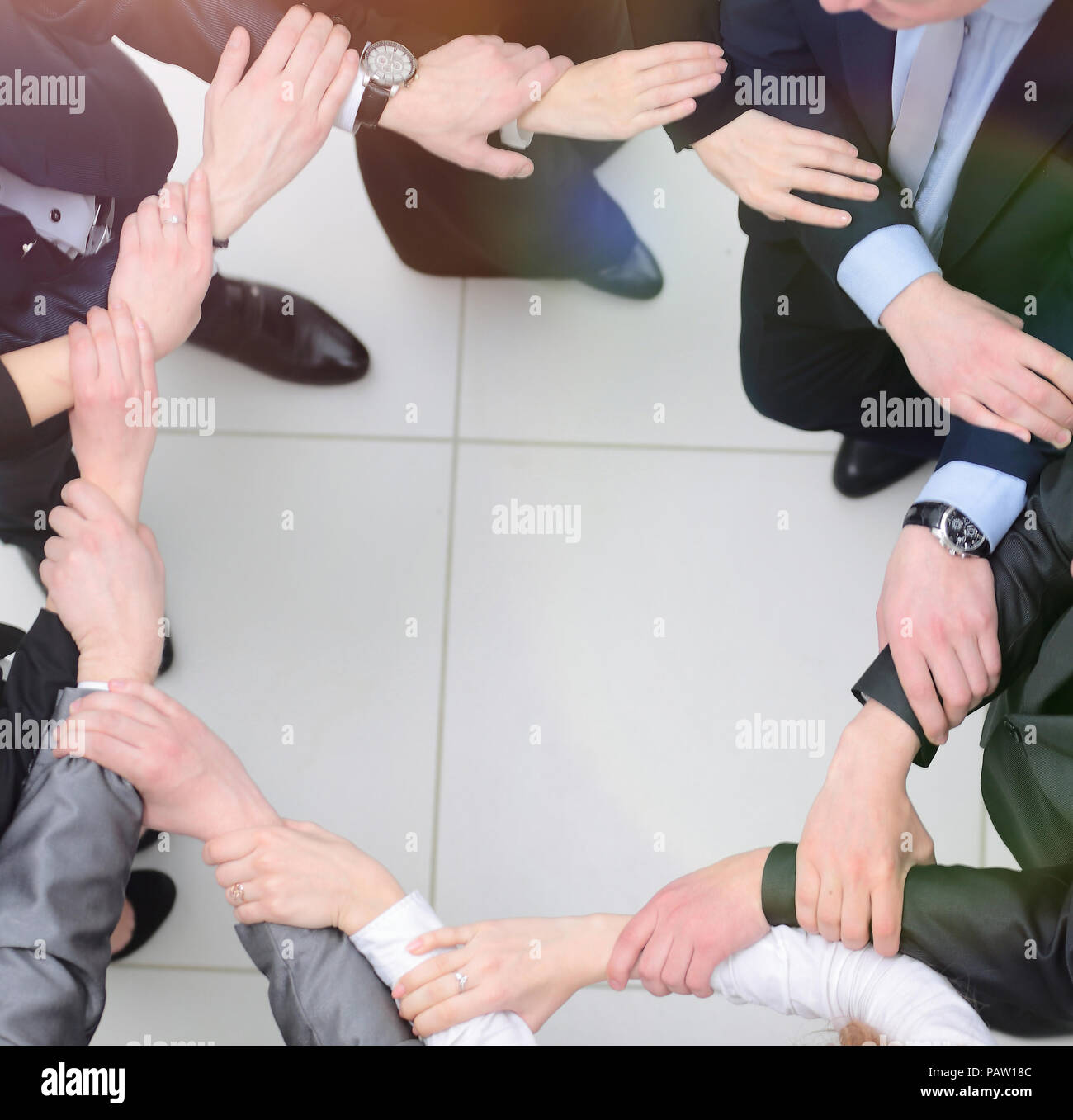 closeup. hands business team form a circle Stock Photo - Alamy