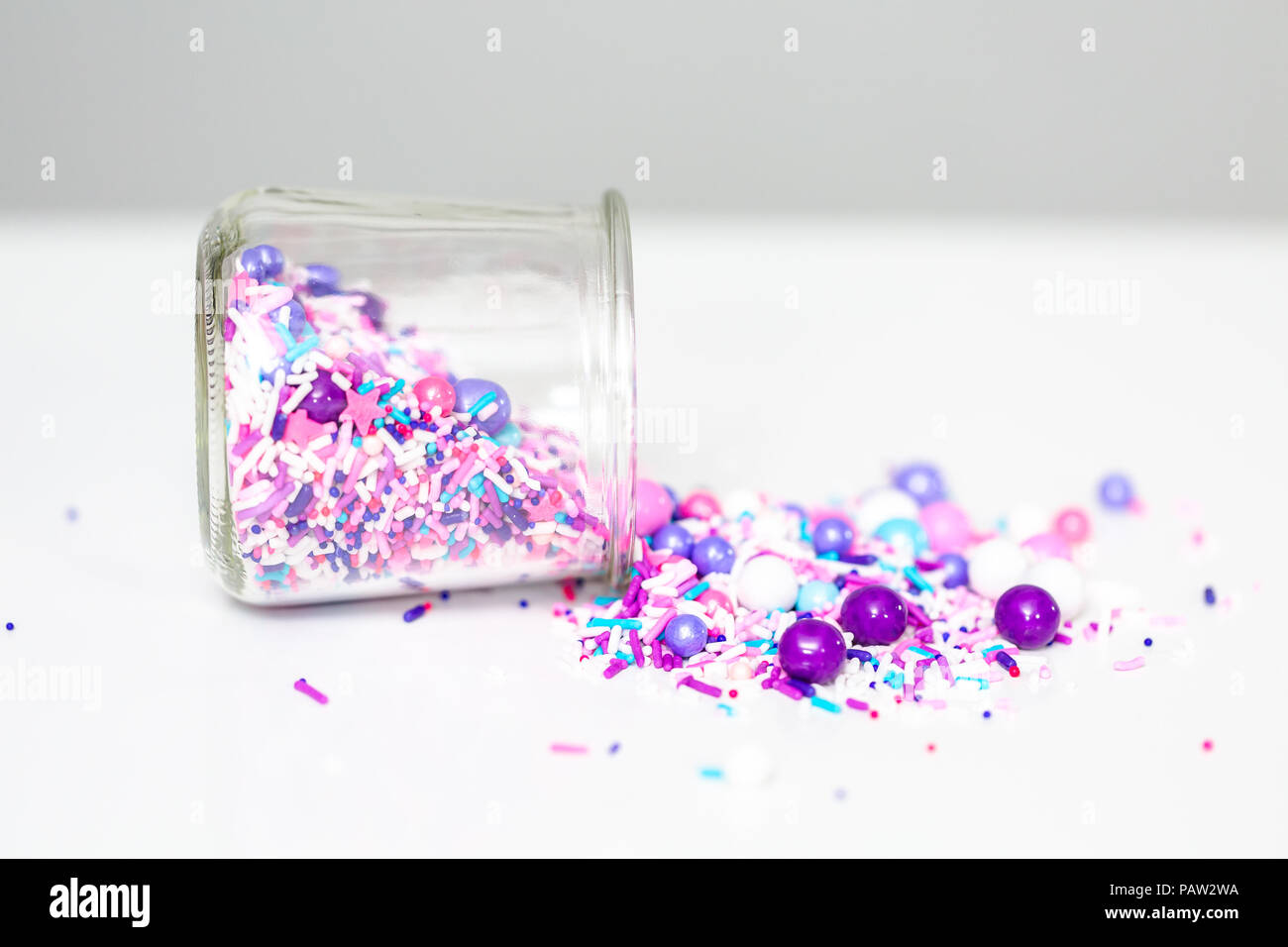 Colorful purple sprinkle blend on a white background Stock Photo - Alamy