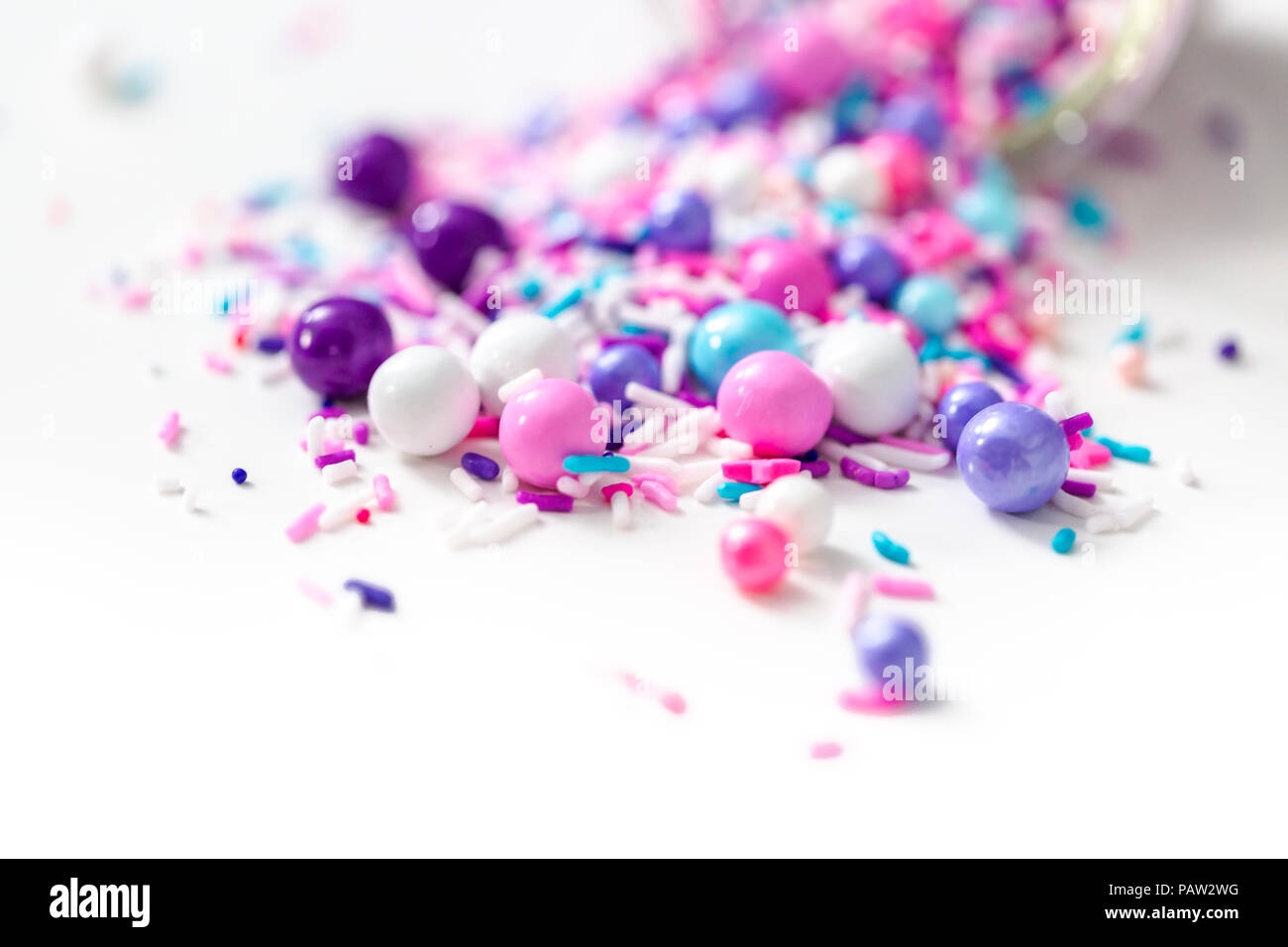 Colorful purple sprinkle blend on a white background Stock Photo - Alamy